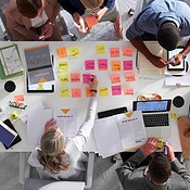 Business people, team and meeting with planning and brainstorming ideas ...