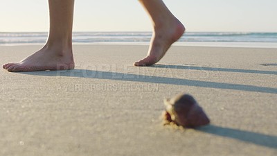 Person feet, walking and beach in sand steps, sea shell and summer ...