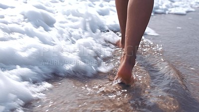 Feet, water and legs on the beach for summer vacation, break or holiday ...