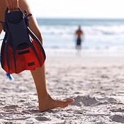 Diving, woman and walking on beach sand for summer vacation, freedom or ...