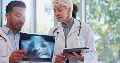 X ray, consulting and teamwork of doctors in hospital with tablet ...