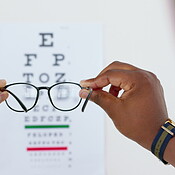 Optometry, letter and healthcare with glasses and chart and doctor for ...