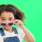 Green screen, fashion and child raise eyebrow with sunglasses for ...