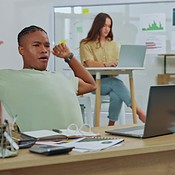 Business, fatigue and black man tired, stretching and overworked with ...