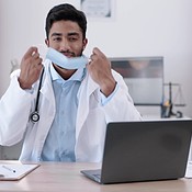 Happy man, doctor and remove face mask in hospital, medical office and ...