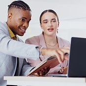 Business people, laptop and coaching intern with documents and writing ...