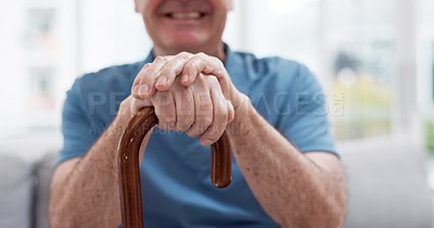 Hands, walking stick and elderly woman with walking stick on a sofa for balance, support and ...