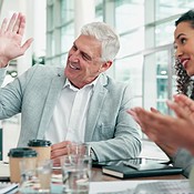 Business people, high five and applause in meeting for leadership ...