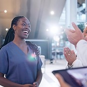 Healthcare, woman doctor and clapping with tablet and success in ...