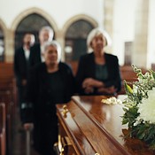 Funeral, church and people with coffin for goodbye, mourning and grief ...