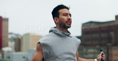 Asian man, fitness and jumping rope on rooftop in city for workout ...
