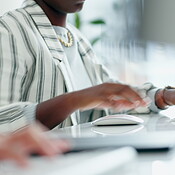 Consultant, typing and hands on keyboard in office with employee ...