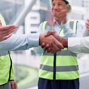 Engineering people, shaking hands and success for construction meeting ...