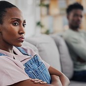 Sofa, angry and black woman in a fight with a man for divorce, stress ...