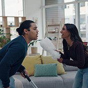 Happy couple in living room, singing and cleaning together with smile ...