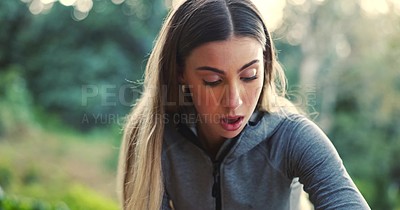 Running, fitness and tired woman in a forest for training, workout and ...