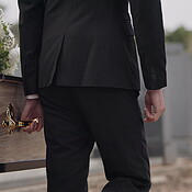 Coffin, hands and man walking at funeral ceremony outdoor with ...