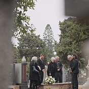 People at a funeral, death and graveyard with family mourning outdoor ...