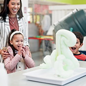 Science, teacher and chemistry experiment in classroom with excited ...