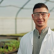 Scientist man, greenhouse and face for agriculture, vegetables or ...