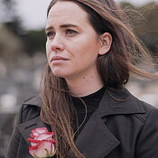 Rose, death or sad woman in graveyard for funeral. spiritual service or ...