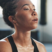 Tired, sweating and breathing with woman in gym for fitness, workout ...