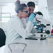 Science laboratory, microscope and team talking, cooperation and study ...