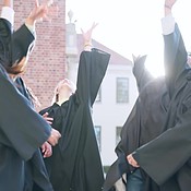 Campus, group and students with graduation, achievement and lens flare ...