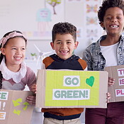 Poster, recycle and happy children in a classroom to support ...