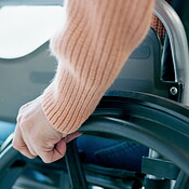 Person with disability, hand and sick in wheelchair, moving and ...