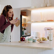 Dessert, phone photo and kitchen woman, social network influencer and ...