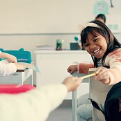 Pencil, friends help and children in classroom, kindergarten and ...