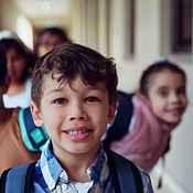 Happy, face and children in line at school in kindergarten, classroom ...