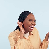 Confused, speak up and face of black woman with ear sign in studio for ...