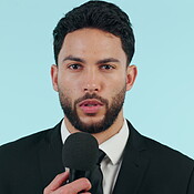 Face, man and news reporter speaking on microphone in studio isolated ...