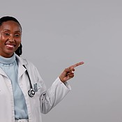 Black woman, doctor and pointing to mockup space in advertising against ...