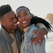 Black couple, ocean and hug with sunset, travel and vacation by the ...