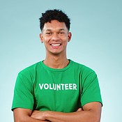 Volunteer man, arms crossed and studio with smile, face or promo for ...