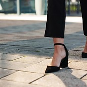 Walking, feet and person in an office for work, arriving at office or ...