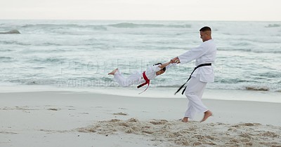 Beach, karate and a father swinging his daughter outdoor for a self ...