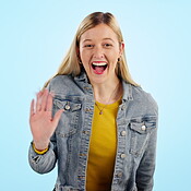 Face, wave palm and excited woman in studio isolated on blue background ...