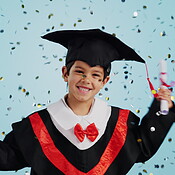 Graduate, child and celebration with confetti and happy dance in studio ...