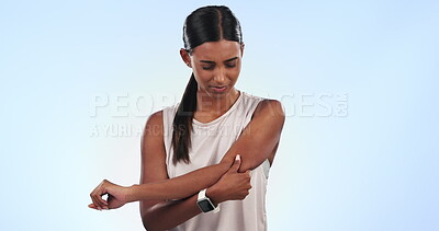 Injury, arm and woman with fitness, pain and inflammation on a blue ...