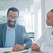 Black people, business and meeting with paperwork in office for ...