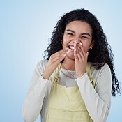 Comedy, woman and laughing in studio, face with positive attitude and ...