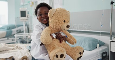 African boy child, hospital and teddy bear on bed with face, smile and ...