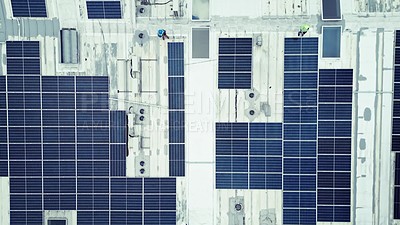 Overhead, solar energy and a construction worker team on a building ...