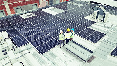 Engineering, people or aerial view with solar panel on building for ...
