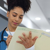 Writing, nurse and document in hospital for insurance, healthcare and ...