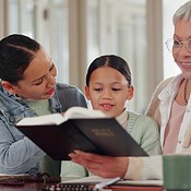 Family, kid and reading Bible for religion, christian education and ...